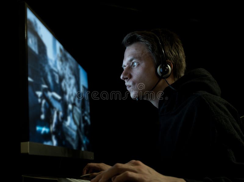 Young gamer in the dark stock photo. Image of headset - 87383672