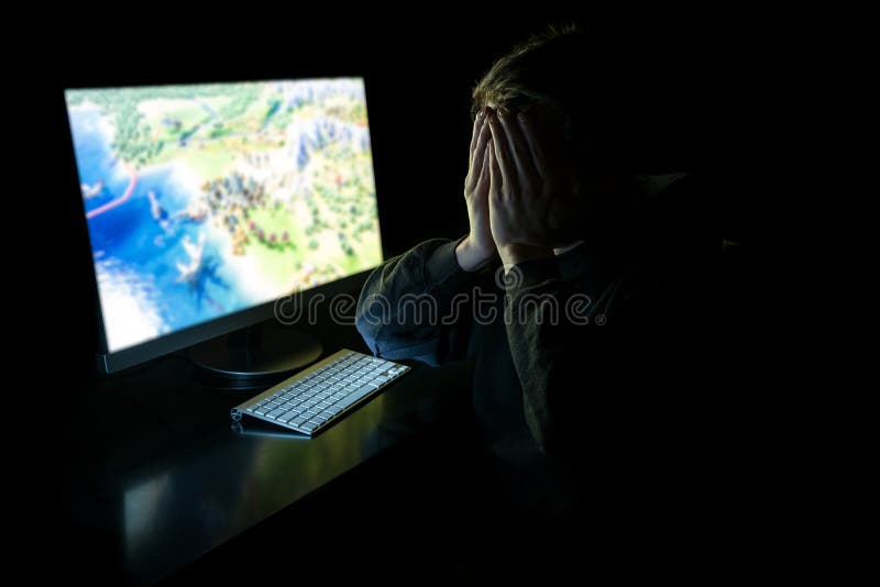 Young gamer in the dark stock image. Image of nerd, emotion - 95135381