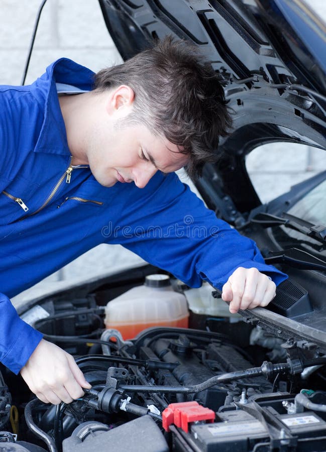 Young Garage Owner Repairing a Motor Stock Photo - Image of check ...