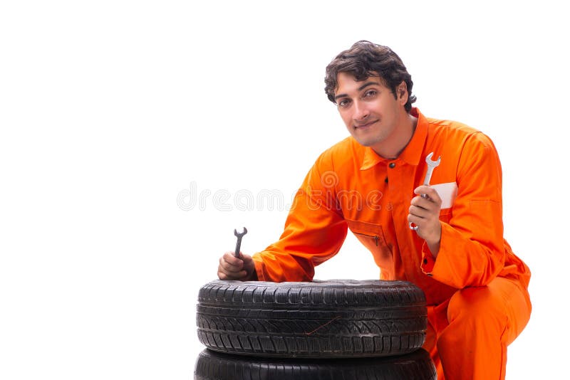 The Young Garage Worker with Tyre Isolated on White Stock Photo - Image ...