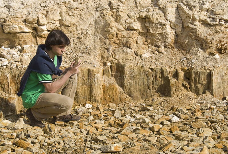 Young Geologist Studying Rock Type Stock Image - Image of feel, shirt ...