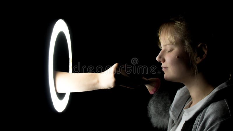 A Young Girl Applying Her Makeup with a Ring Light Stock Image - Image ...