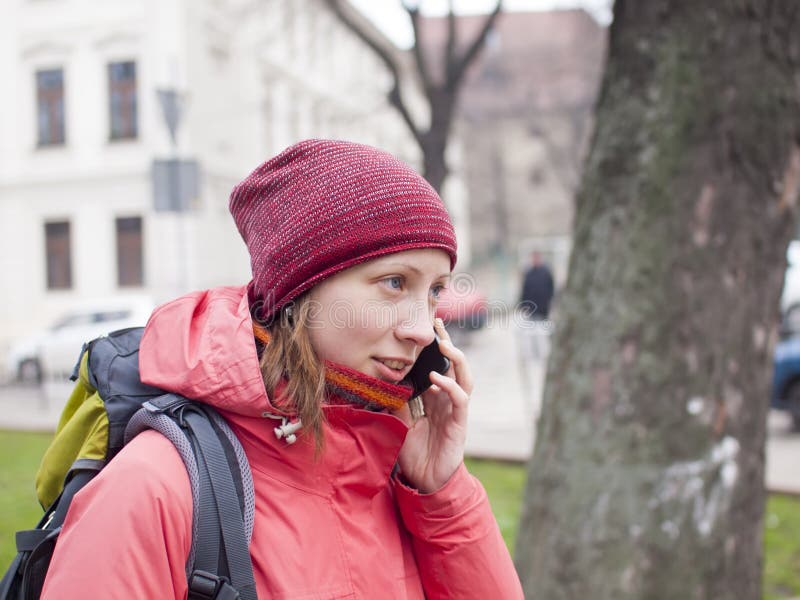 A Young Girl with a Backpack and Phone. Stock Image - Image of ...