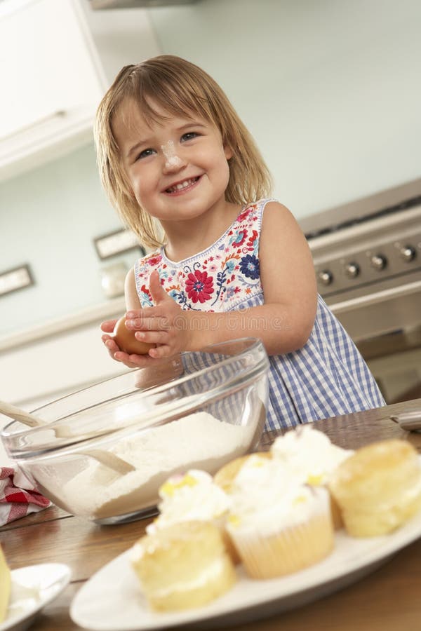Young Girl Baking Cakes in Kitchen Stock Image - Image of vertical ...