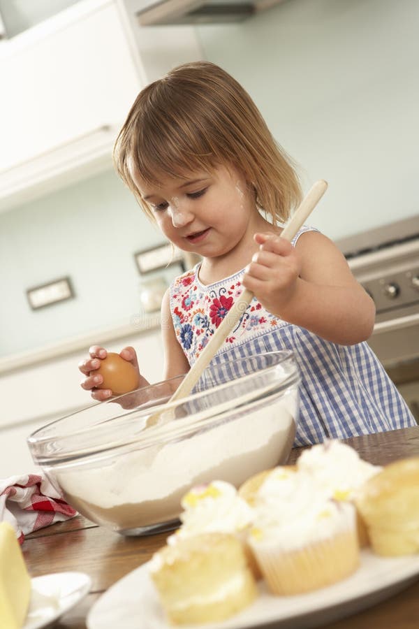Young Girl Baking Cakes in Kitchen Stock Photo - Image of vertical ...