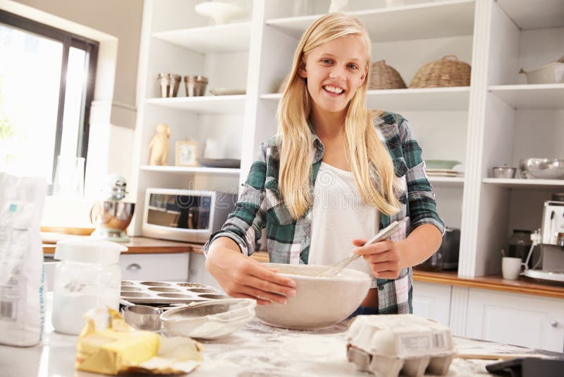 Young girl baking at home stock image. Image of enjoyment - 54731507