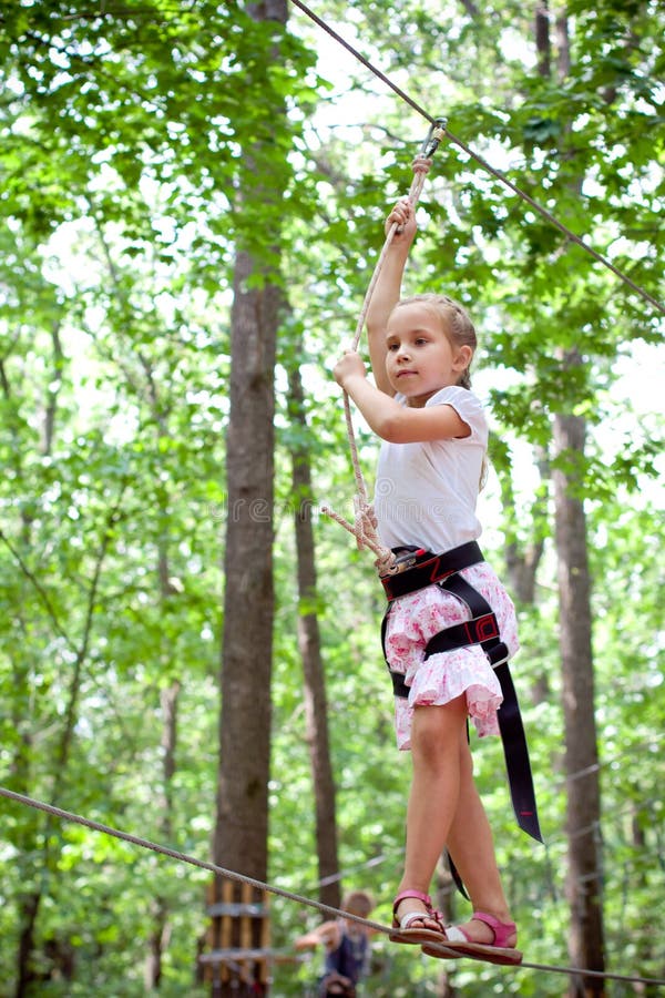 Young Girl Balancing on Rope Stock Image - Image of alone, forest: 25712191