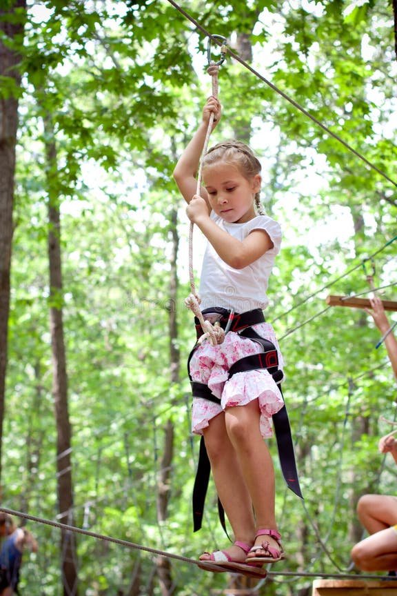 Young Girl Balancing on Rope Stock Photo - Image of climbing, girl ...