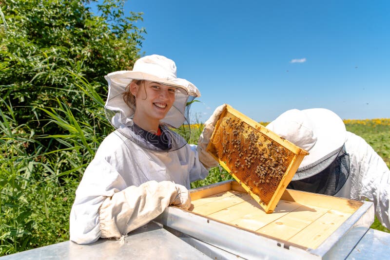 Young Girl Beekeeper in a Field Stock Image - Image of protective ...