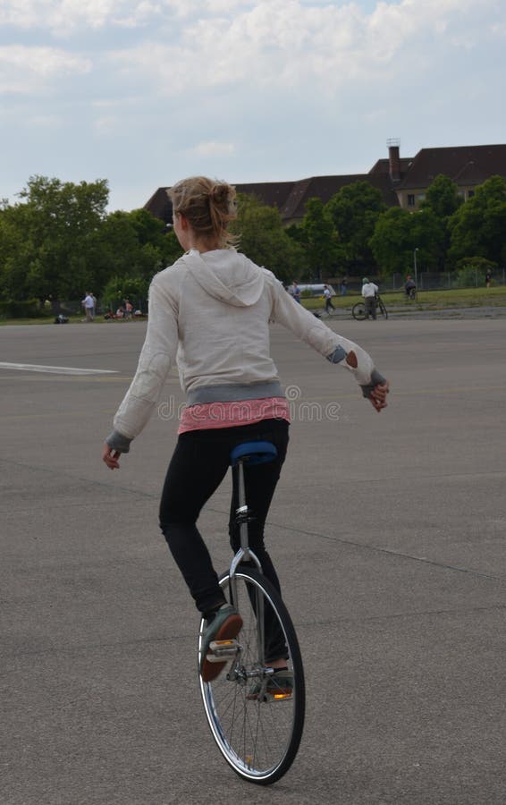 A Young Girl on Bicycle with only One Wheel Stock Image - Image of ... A Young Girl on Bicycle with only One Wheel Stock Image - Image of ...