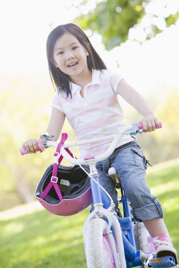 Young Girl Riding Bicycle stock photo. Image of happy - 5547092