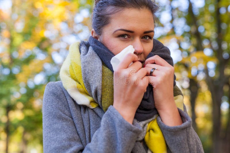 Young Girl is Blowing Her Nose. she is Cold. Autumn Time. Stock Image ...