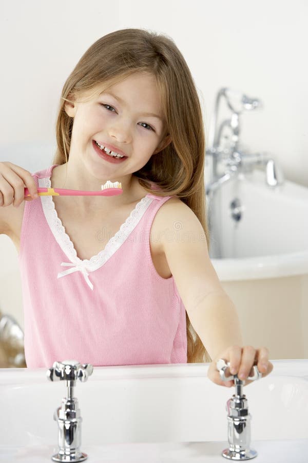 Young Girl Brushing Teeth at Sink Stock Photo - Image of teeth, home ...