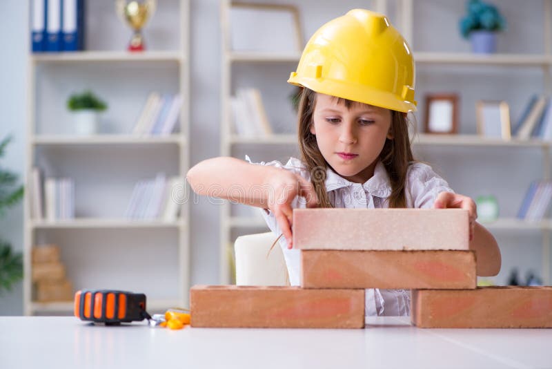 The Young Girl Building with Construction Bricks Stock Photo - Image of ...