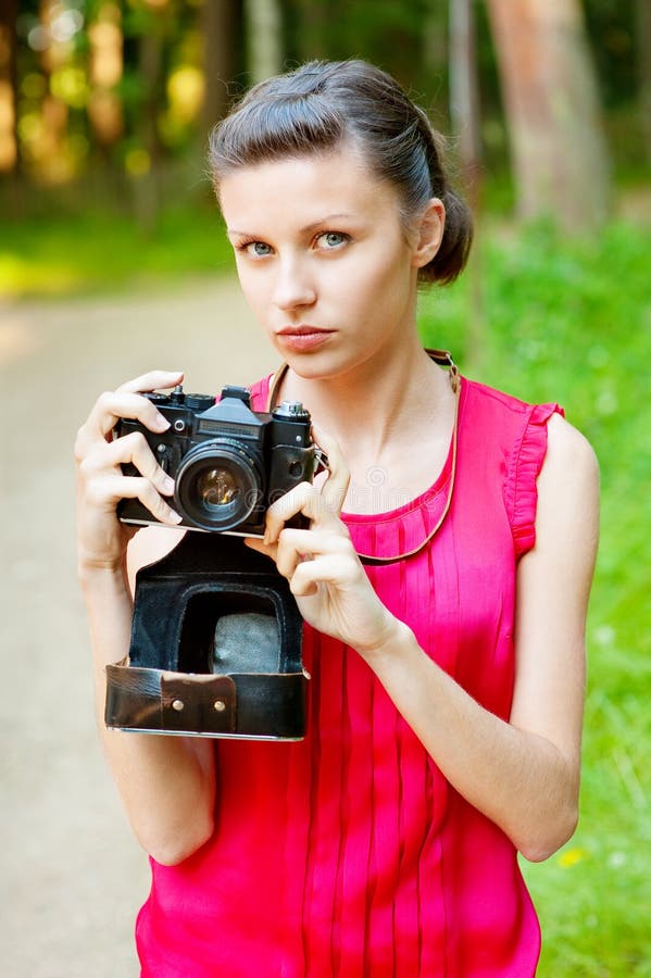Young girl with camera stock image. Image of profession - 13249971