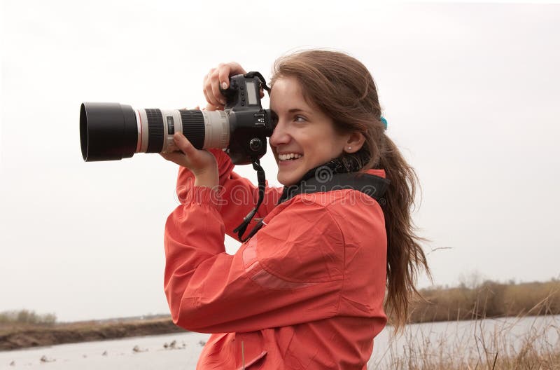 Young girl with camera stock image. Image of technology - 14153121