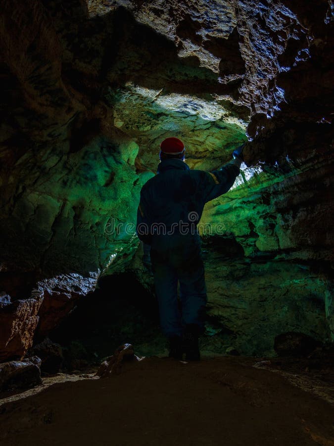 Caver exploring the cave stock photo. Image of female - 28127306