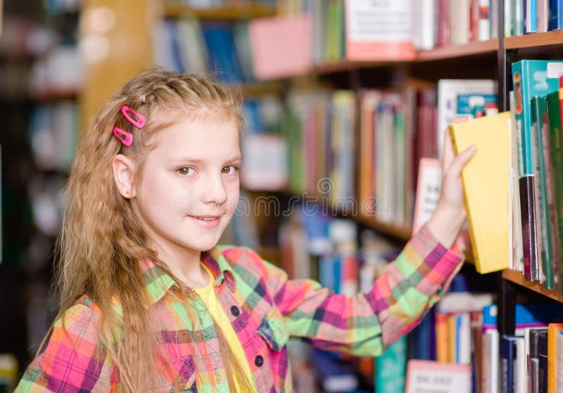 Shocked Girl Reading a Book in the Library Stock Image - Image of book ...