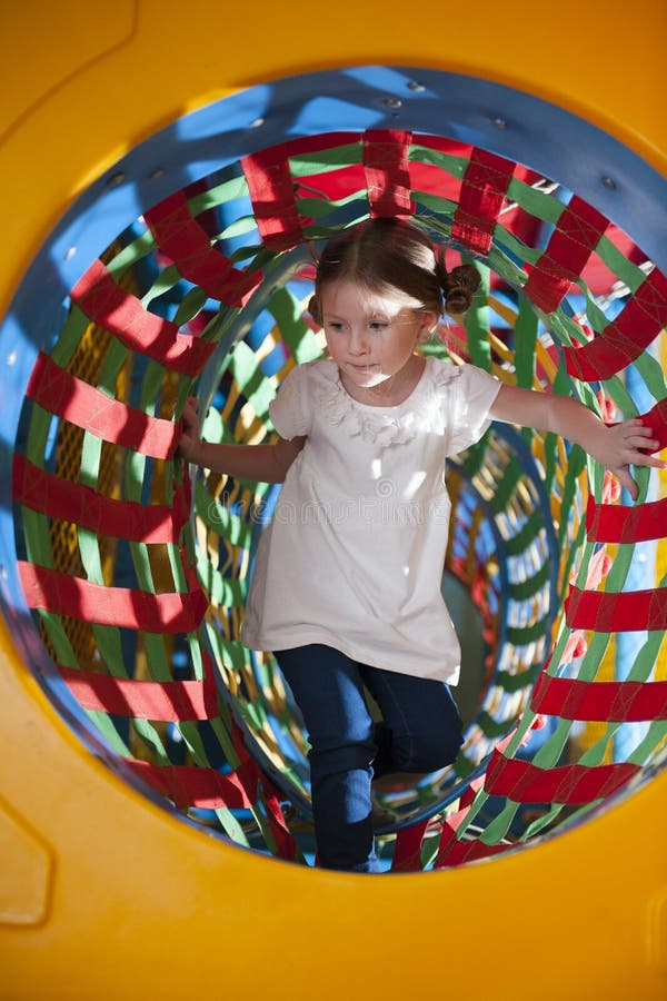 Young Girl Climbs through Netted Tunnel in Soft Play Centre Stock Photo ...