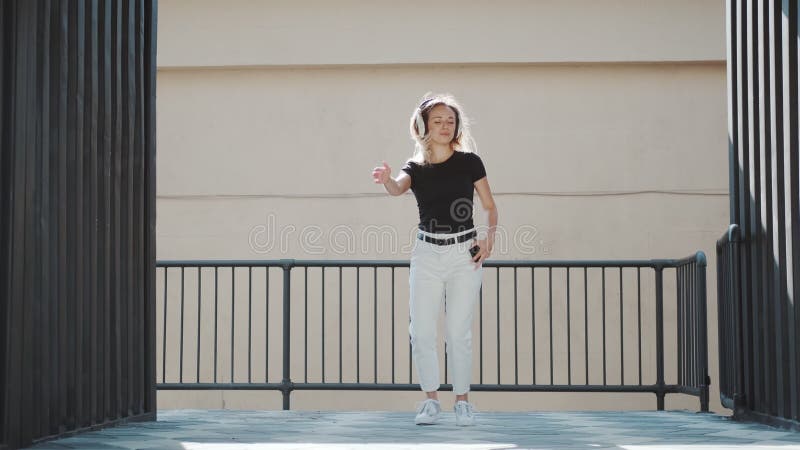 The Young Girl Is Dancing Happily And Bouncing High Stock Footage
