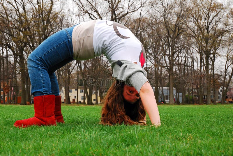 A Young Girl Demonstrates a Backbend Stock Image - Image of daytime ...