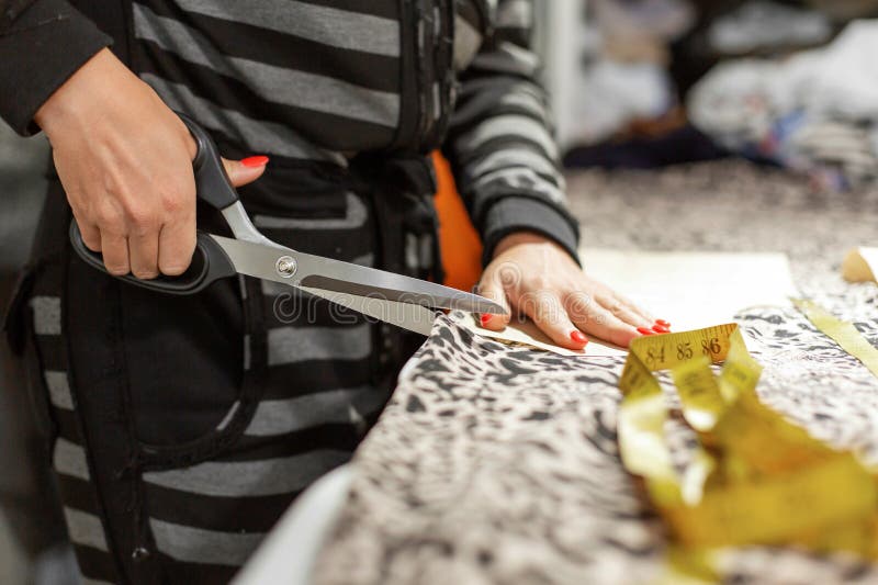 A Young Girl Designer of Clothes, Cut Fabric by Pattern To Create ...