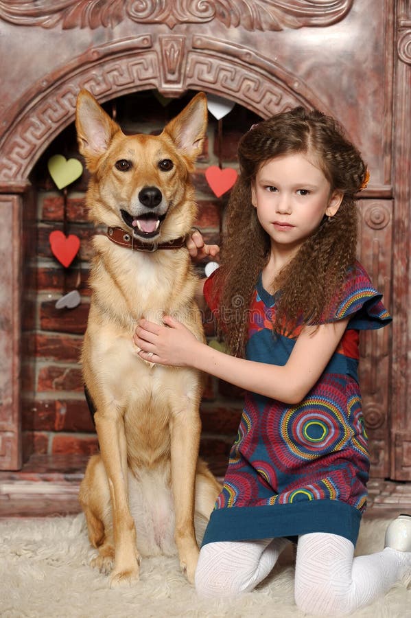Young girl with dog stock image. Image of girl, golden - 31692999