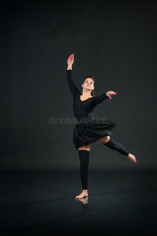 Gymnast Woman is Exercising in Gym on Black Background Stock Photo ...