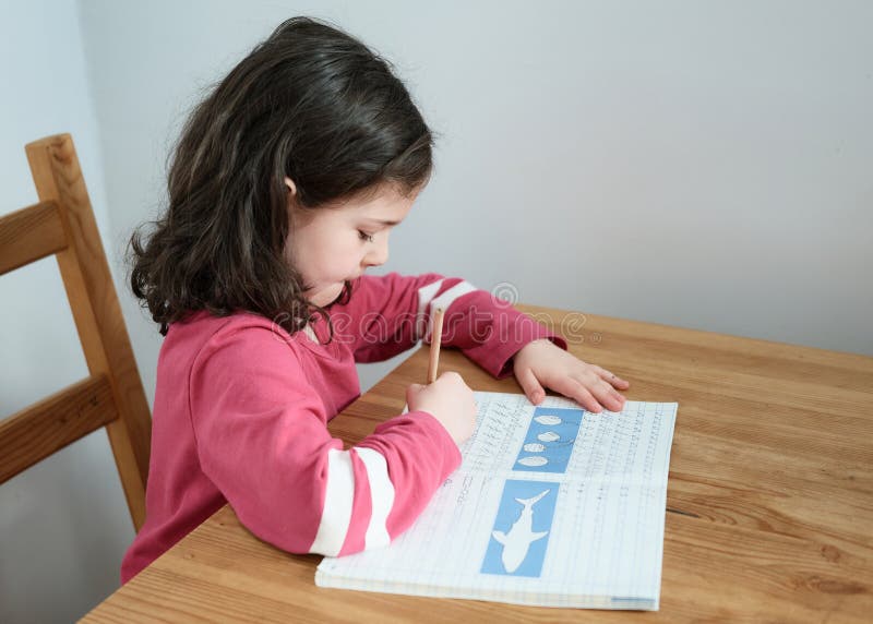 Young Girl is Practicing Drawing Skills Stock Photo - Image of biracial ...
