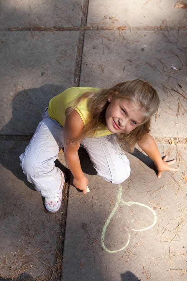 Young Girl is Drawing on the Concrete Ground Stock Image - Image of ...