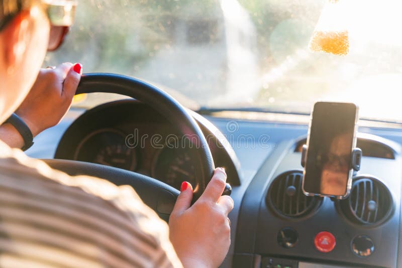 Young Girl Driving a Car while Driving, Rear View Stock Image - Image ...