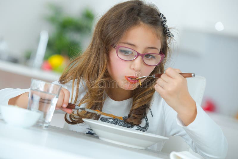 Young girl eating stock image. Image of looking, greedy - 197918119