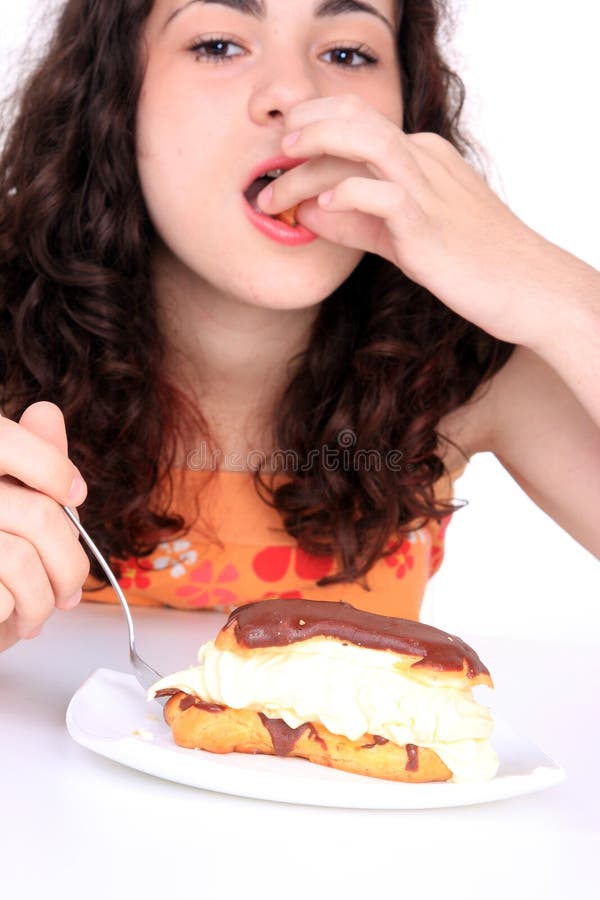 Young girl eating cake stock photo. Image of female, girl - 9739992