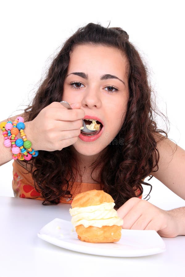 Young girl eating cake stock photo. Image of female, girl - 9739992