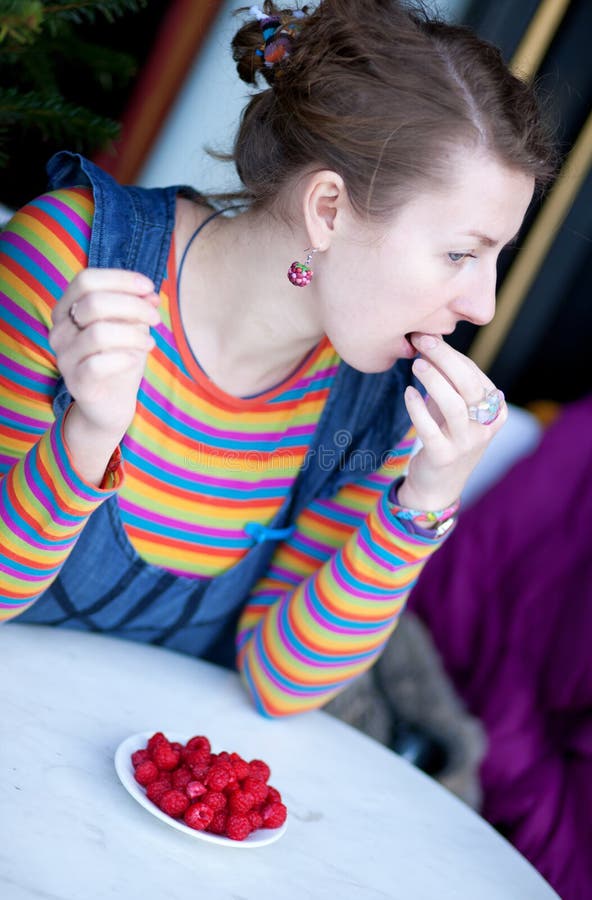 Young Girl Eating Raspberry Stock Image - Image of pink, fruit: 17750191