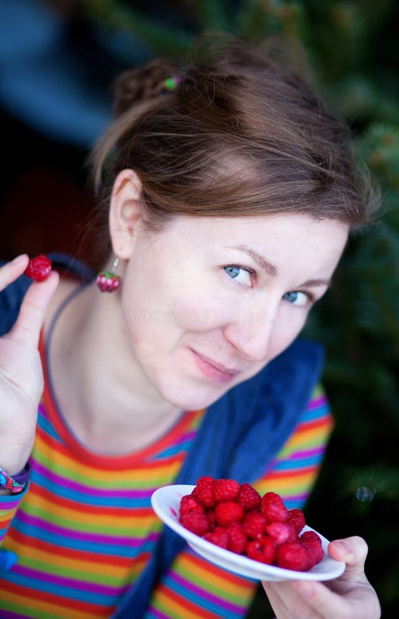 Young Girl Eating Raspberry Stock Photo - Image of magenta, adult: 17782822