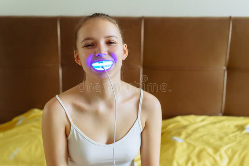 A Young Girl is Engaged in Home Teeth Whitening. Stock Photo - Image of ...