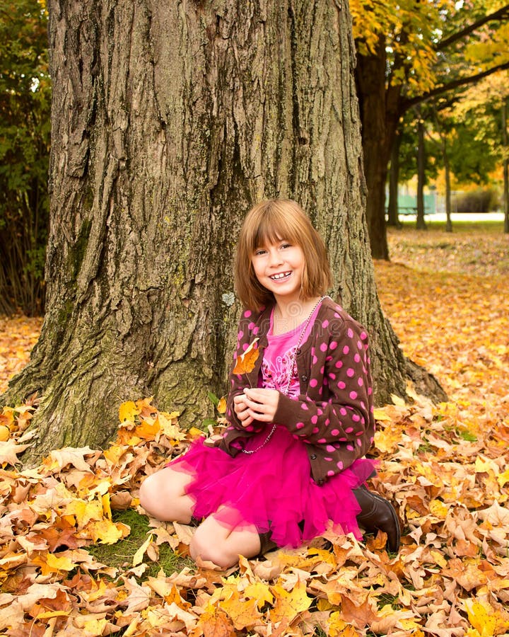 Young Girl Enjoying Autumn stock image. Image of leaves - 21528729