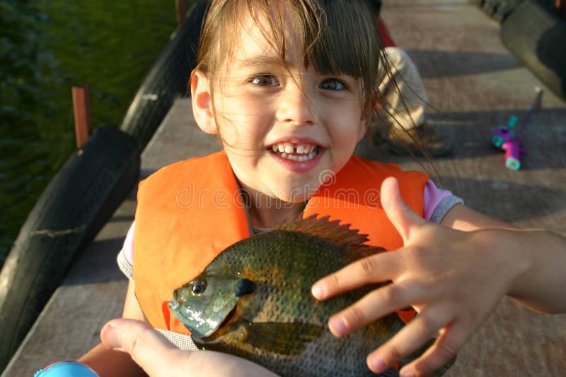 A Young Girl Excited about Her First Sunfish Stock Photo - Image of ...
