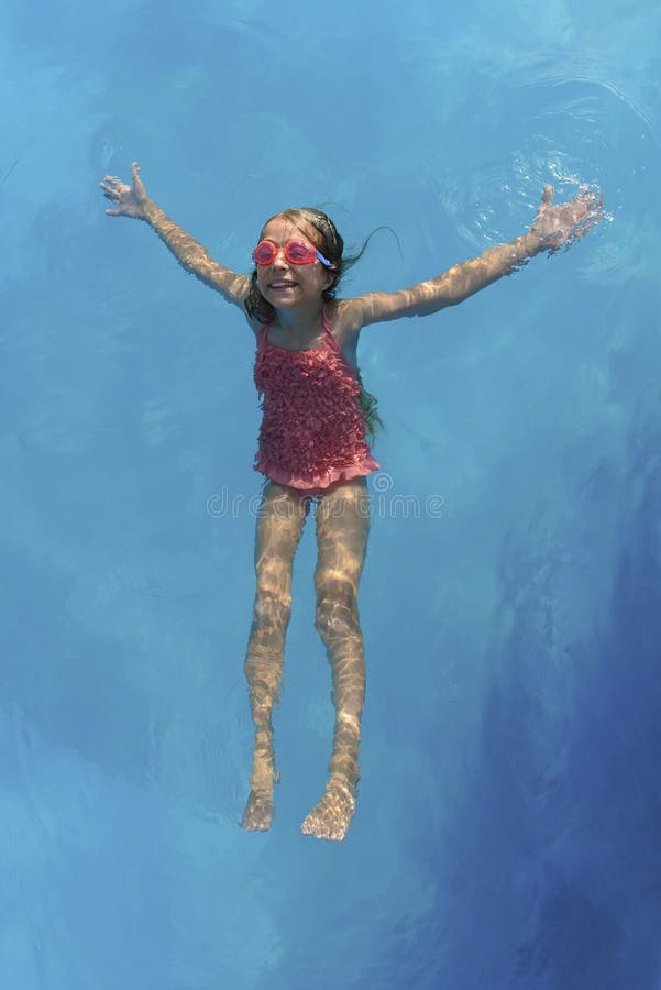 Young Girl Floating on Water Surface Stock Image - Image of cheerful ...