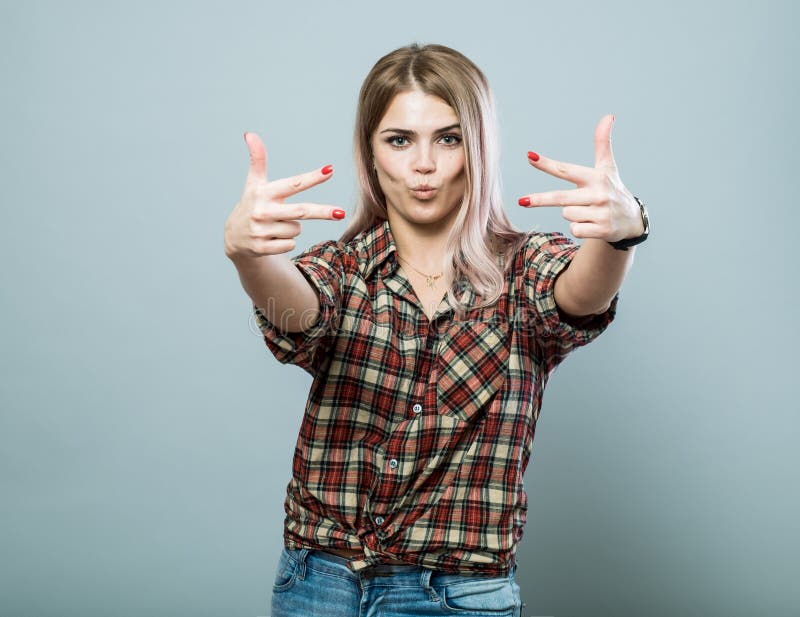 Young Girl with Fun Gestures Stock Photo - Image of shirt, cool: 89199172