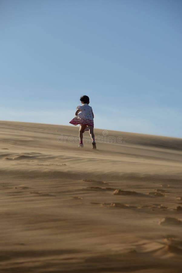 Young Girl Going Uphill in Desert Stock Image - Image of backgrounds ...