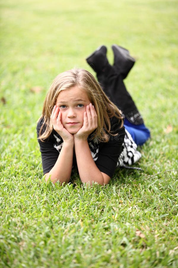 Young Girl on the Grass stock photo. Image of caucasian - 27935586