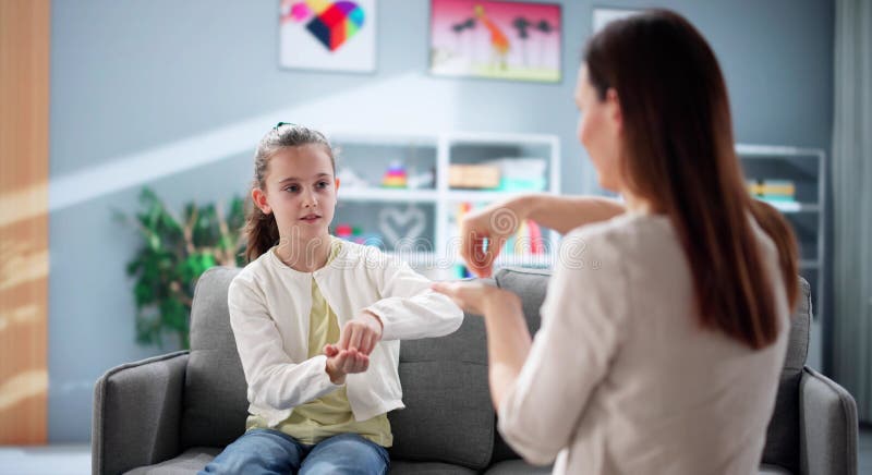 Young Girl Happily Learning Sign Language Stock Photos - Free & Royalty ...
