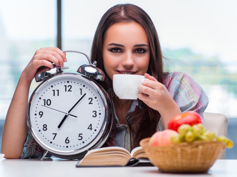 Young Girl Having Breakfast on the Morning Stock Photo - Image of clock ...