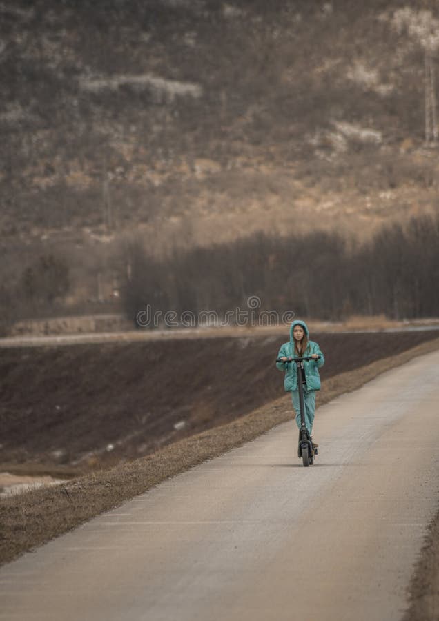 Young Girl Having Fun with a Scooter on the Road Stock Photo - Image of ...