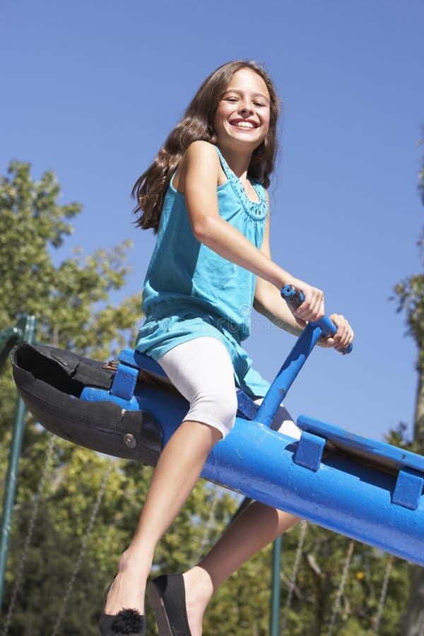 Young Girl Having Fun on Seesaw Stock Photo - Image of caucasian ...