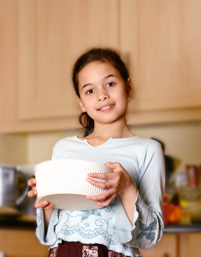 A Young Girl Helping Out the Family Stock Image - Image of girl ...