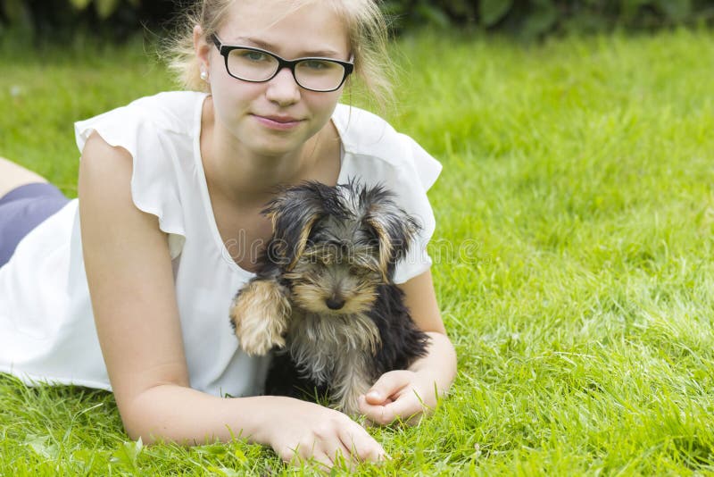 Young girl and her dog stock image. Image of blond, canine - 49199295