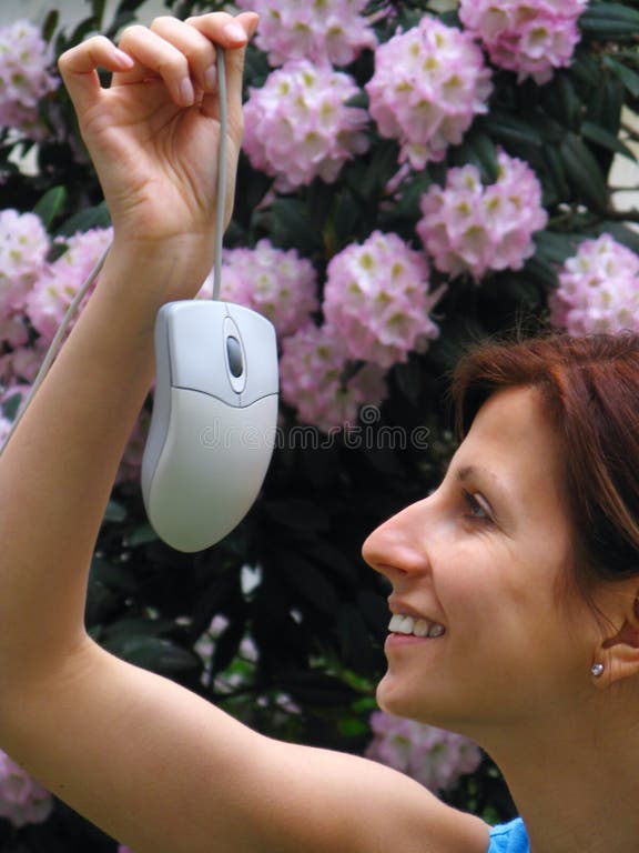 Young Girl Holding Computer Mouse Stock Photo - Image of garden, adult ...